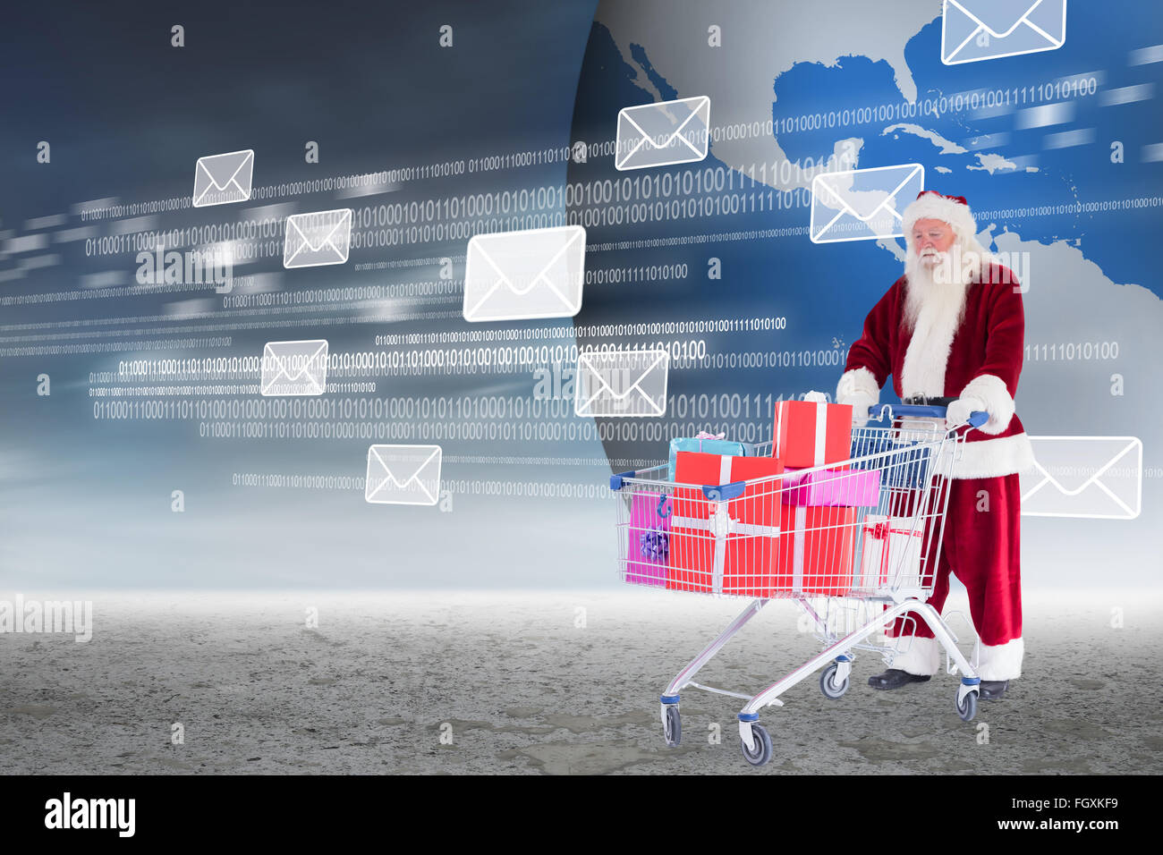 Composite image of santa delivering gifts from cart Stock Photo - Alamy