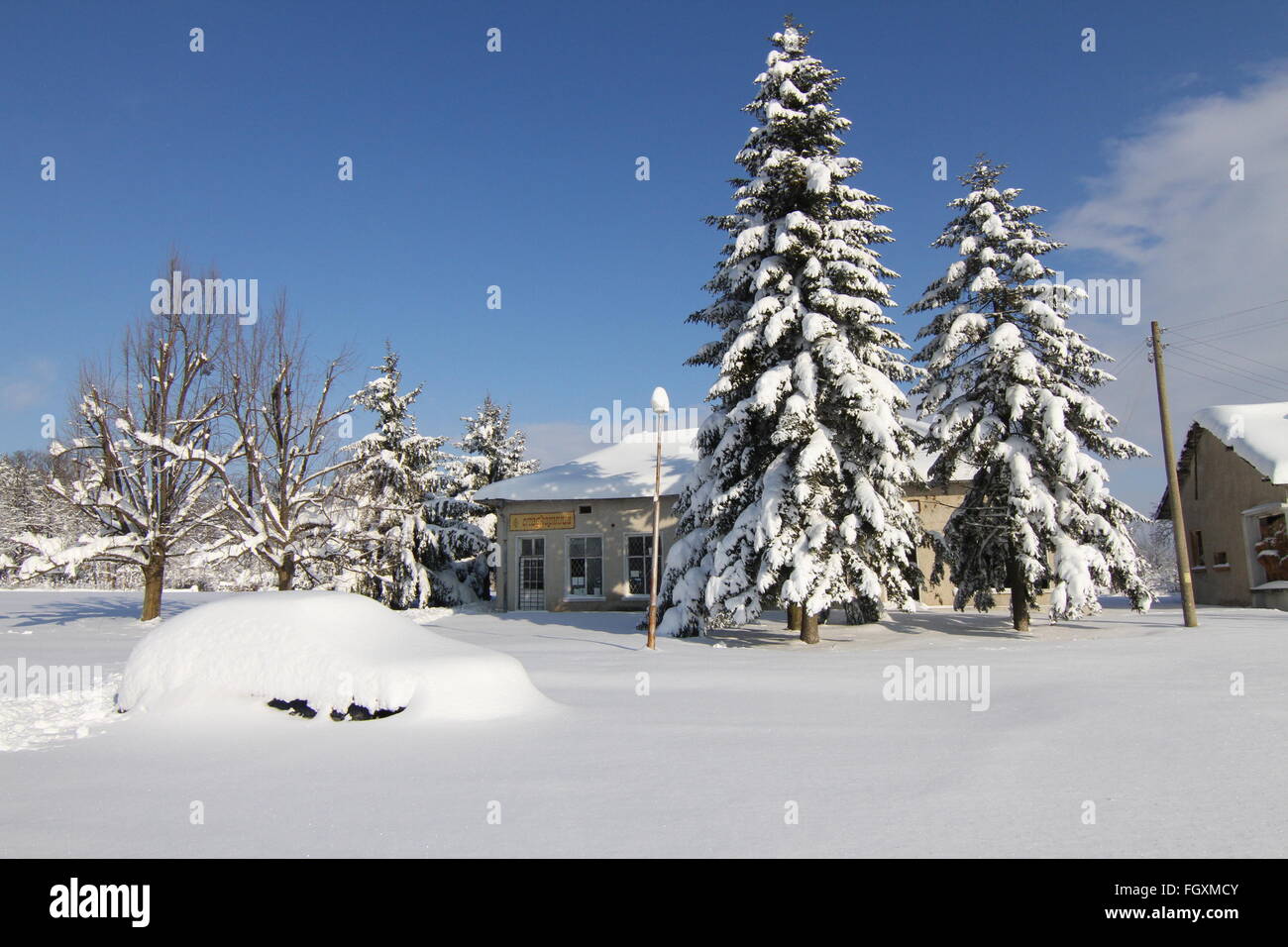 Bulgarians try to shovel the heavy snow from their cars near the ...
