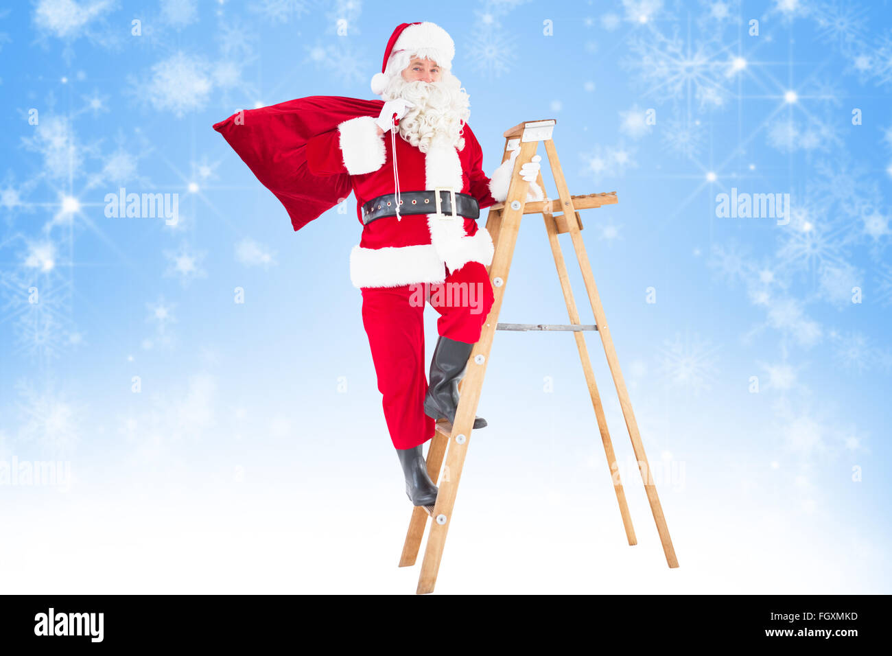 Composite image of santa claus climbing a ladder Stock Photo - Alamy