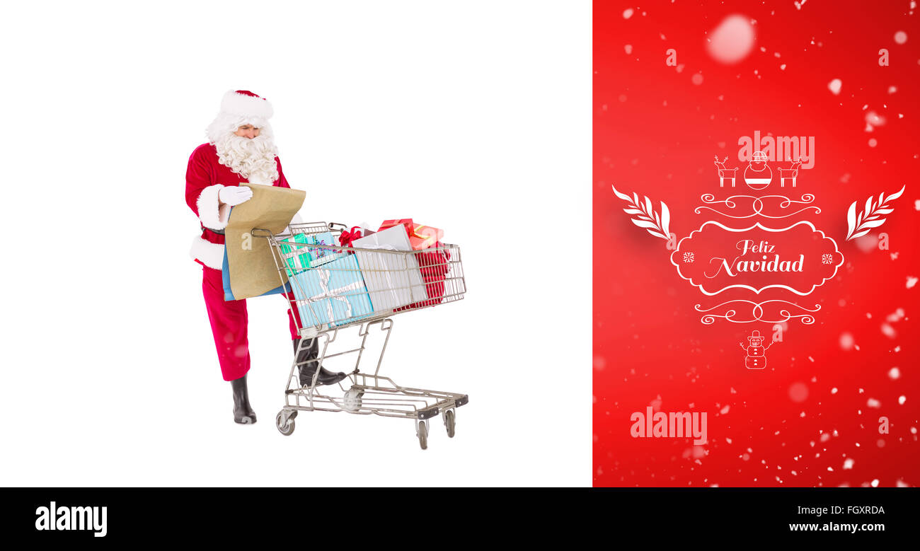 Composite image of santa delivering gifts with a trolley Stock Photo ...