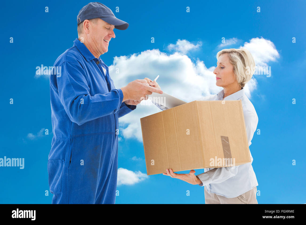 Composite image of happy delivery man with customer Stock Photo - Alamy