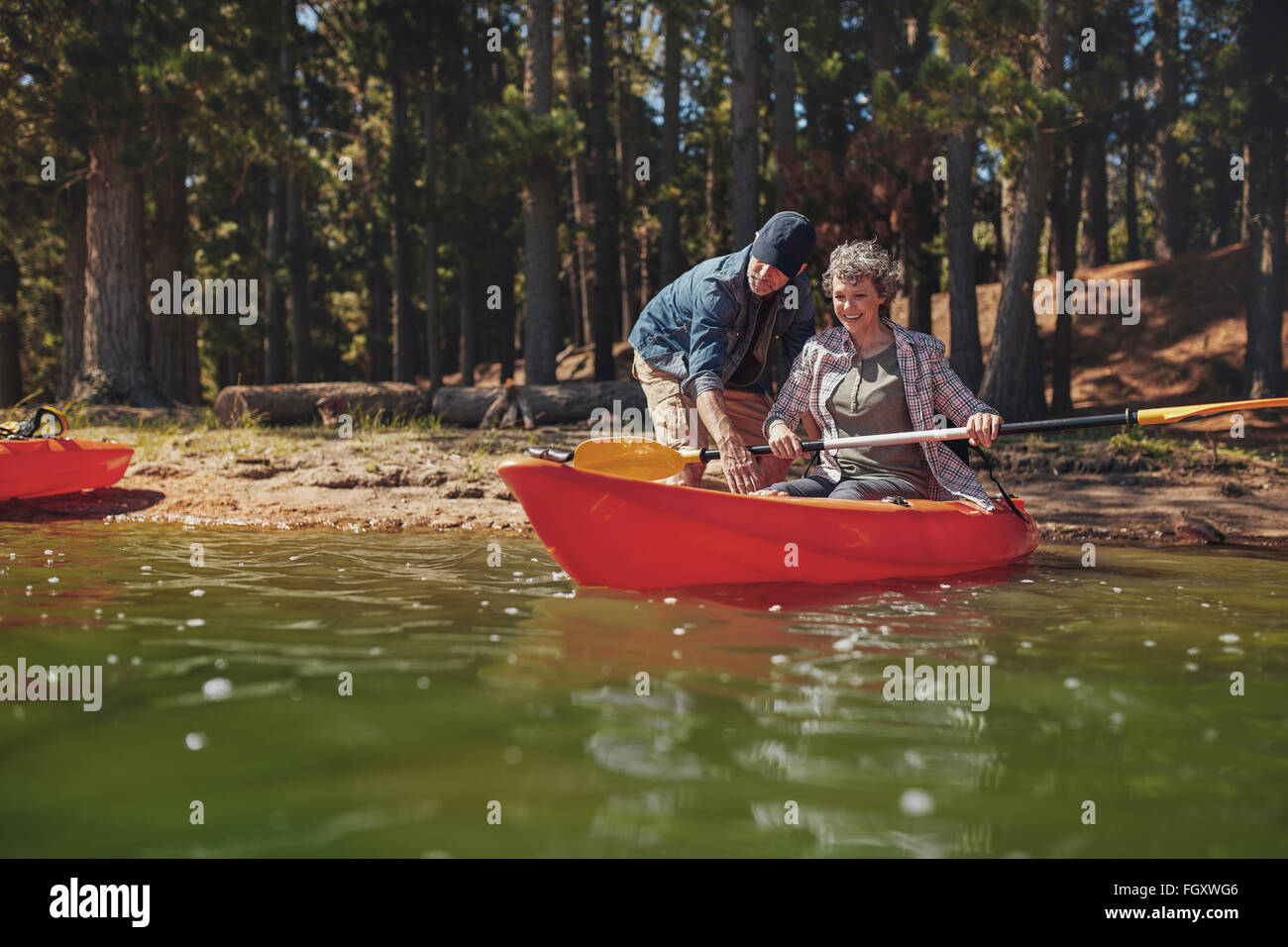 Man his wife and the canoe hi-res stock photography and images - Alamy