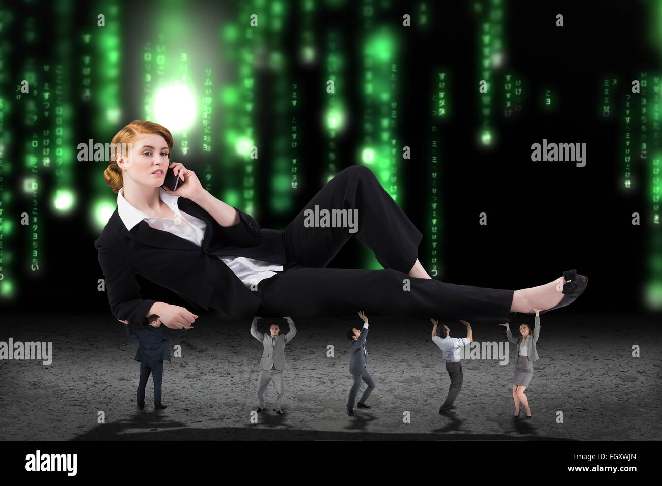 Composite image of business people supporting boss Stock Photo - Alamy