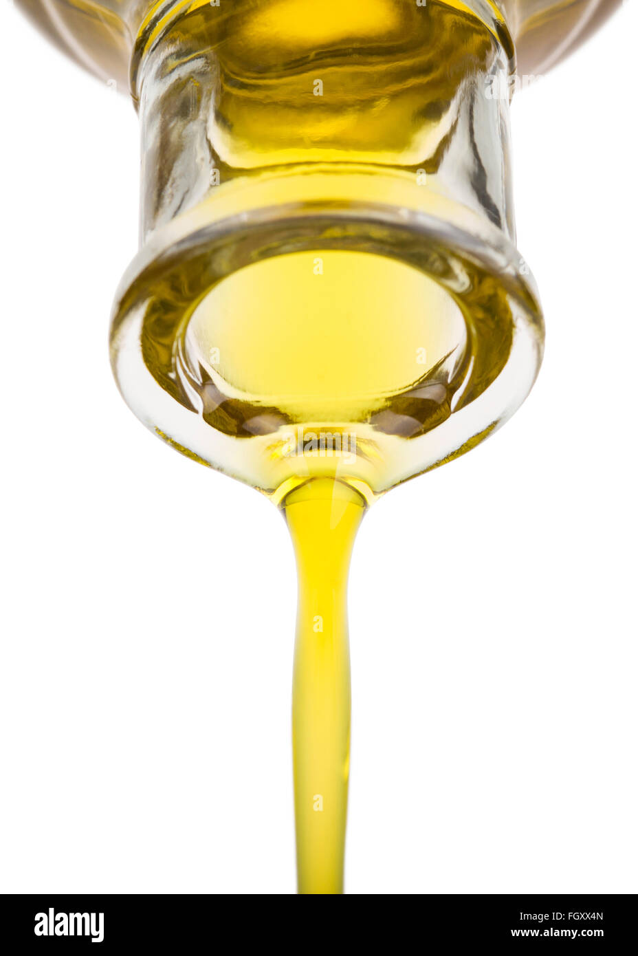 Oil pouring from a bottle. Isolated on white Stock Photo - Alamy