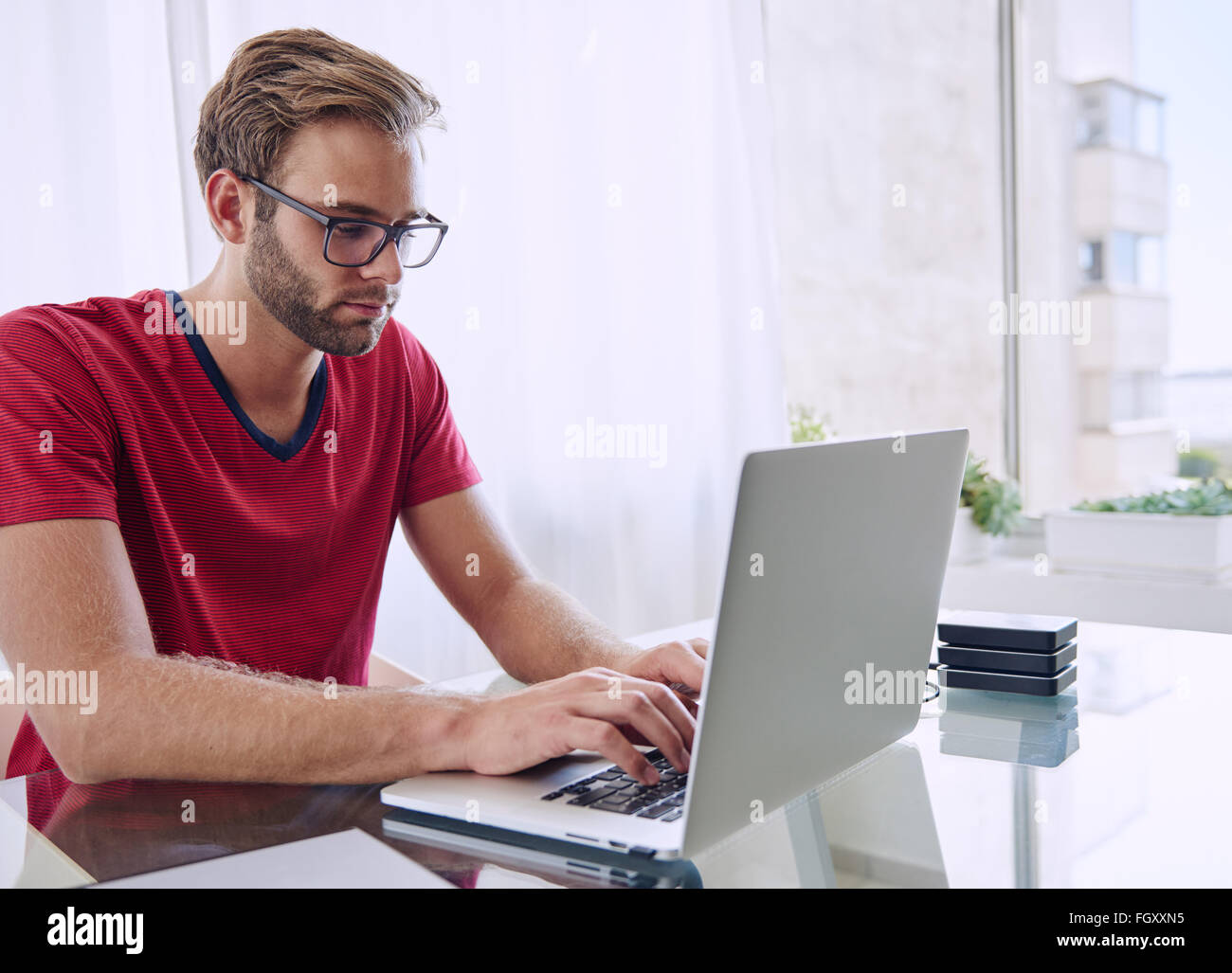 Man concentrating on getting his work done Stock Photo - Alamy