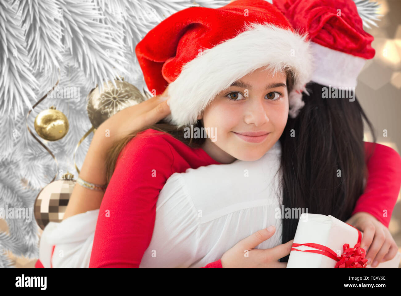 Composite image of little girl getting gift Stock Photo - Alamy