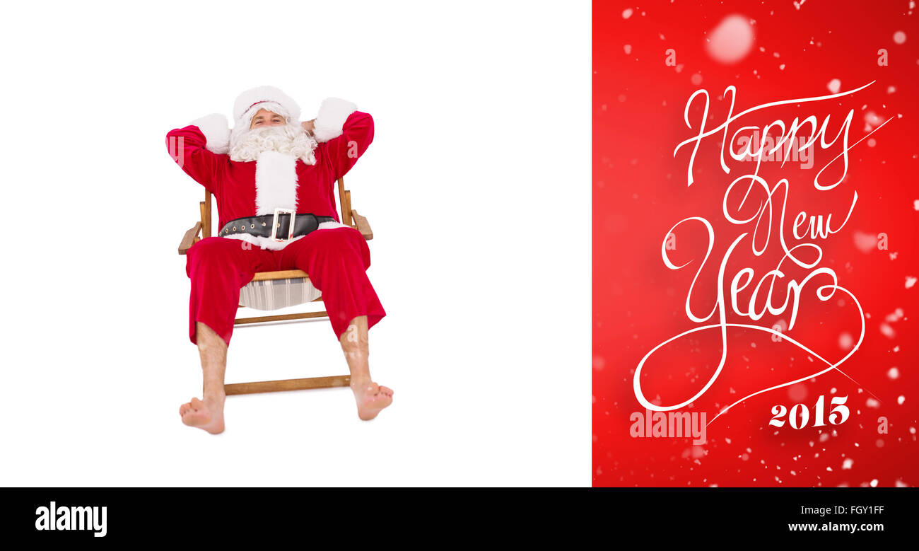 Composite image of happy santa relaxing on deckchair Stock Photo - Alamy
