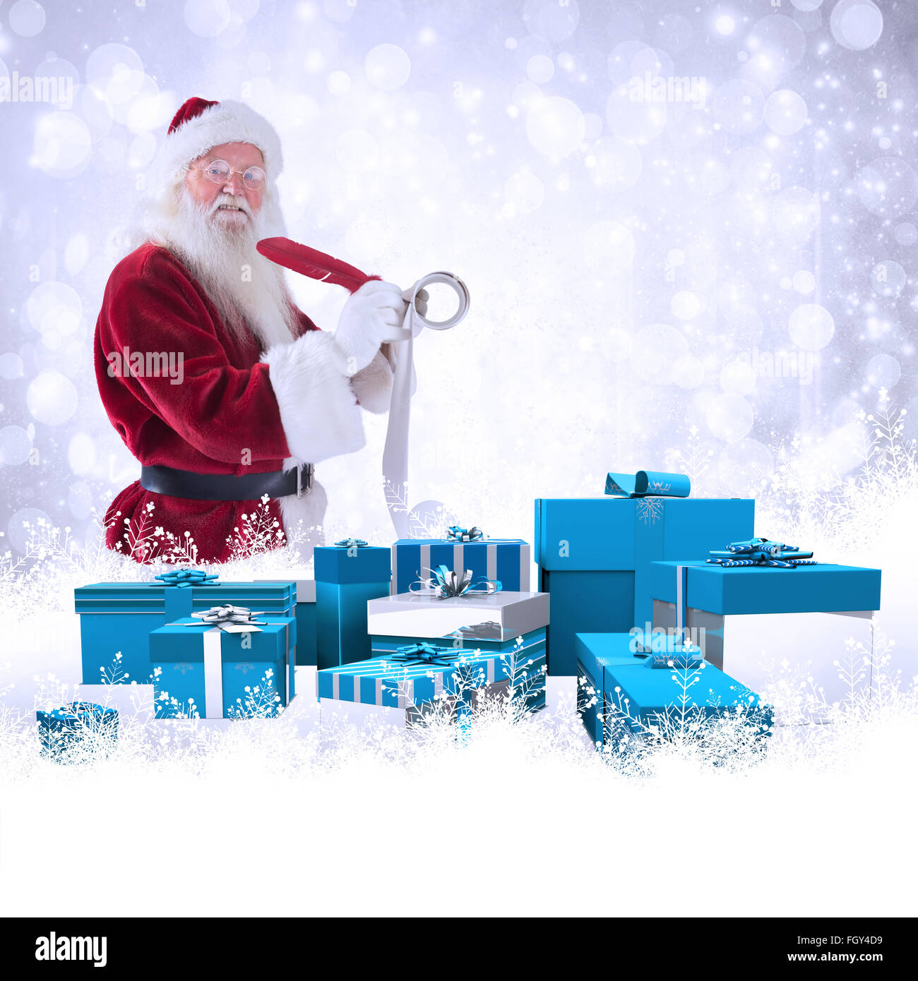 Composite image of santa writing his list Stock Photo - Alamy