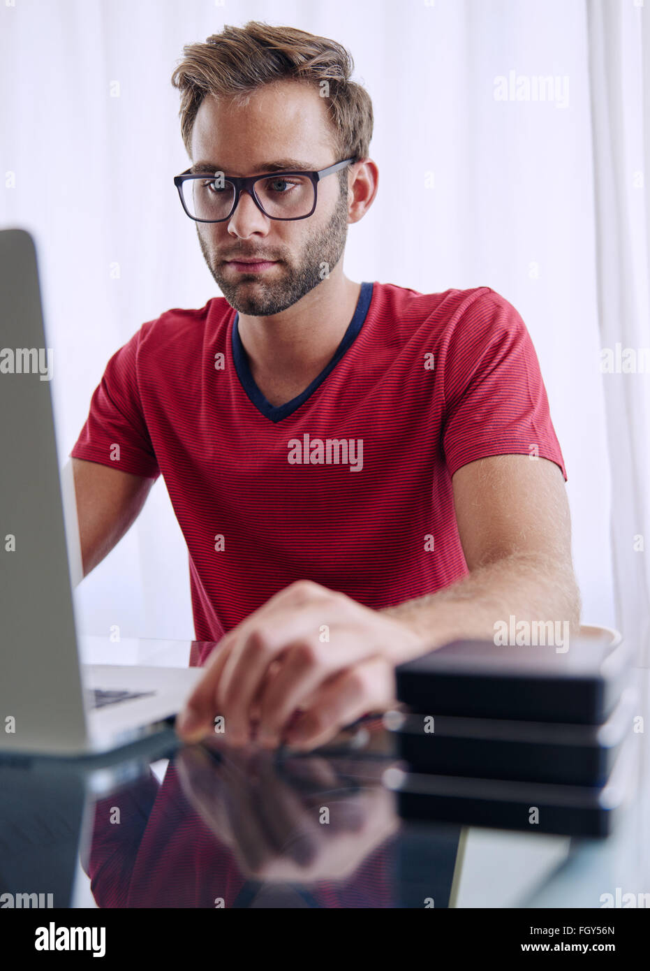 Man busy inserting a memory stick into his notebook Stock Photo - Alamy