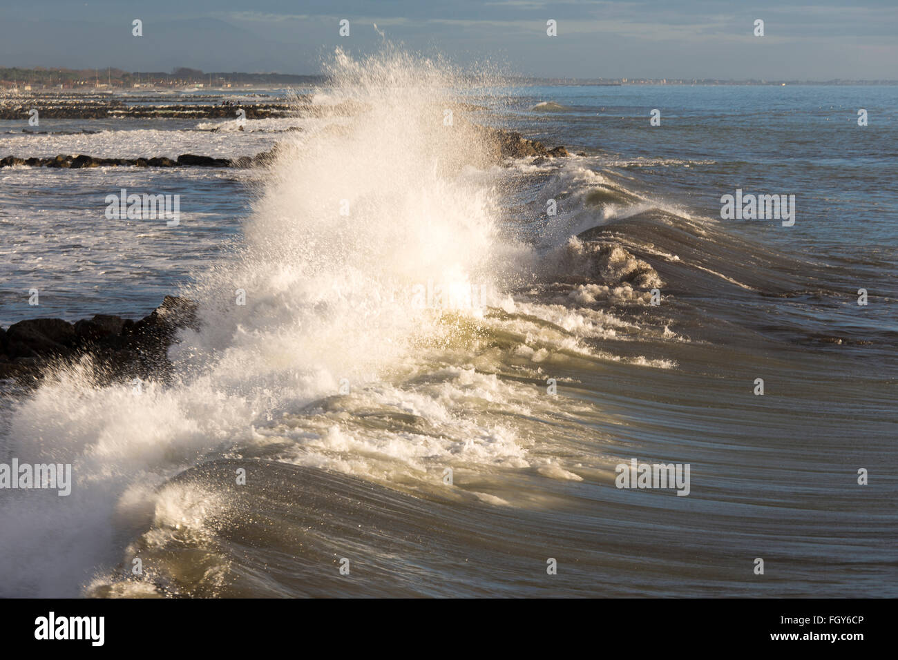 Wave exploding towards the coast Stock Photo - Alamy