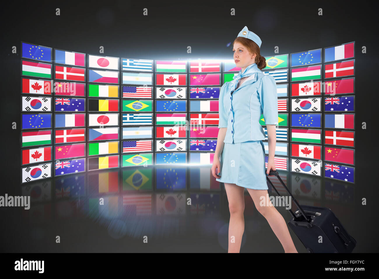 Composite image of pretty air hostess pulling suitcase Stock Photo - Alamy