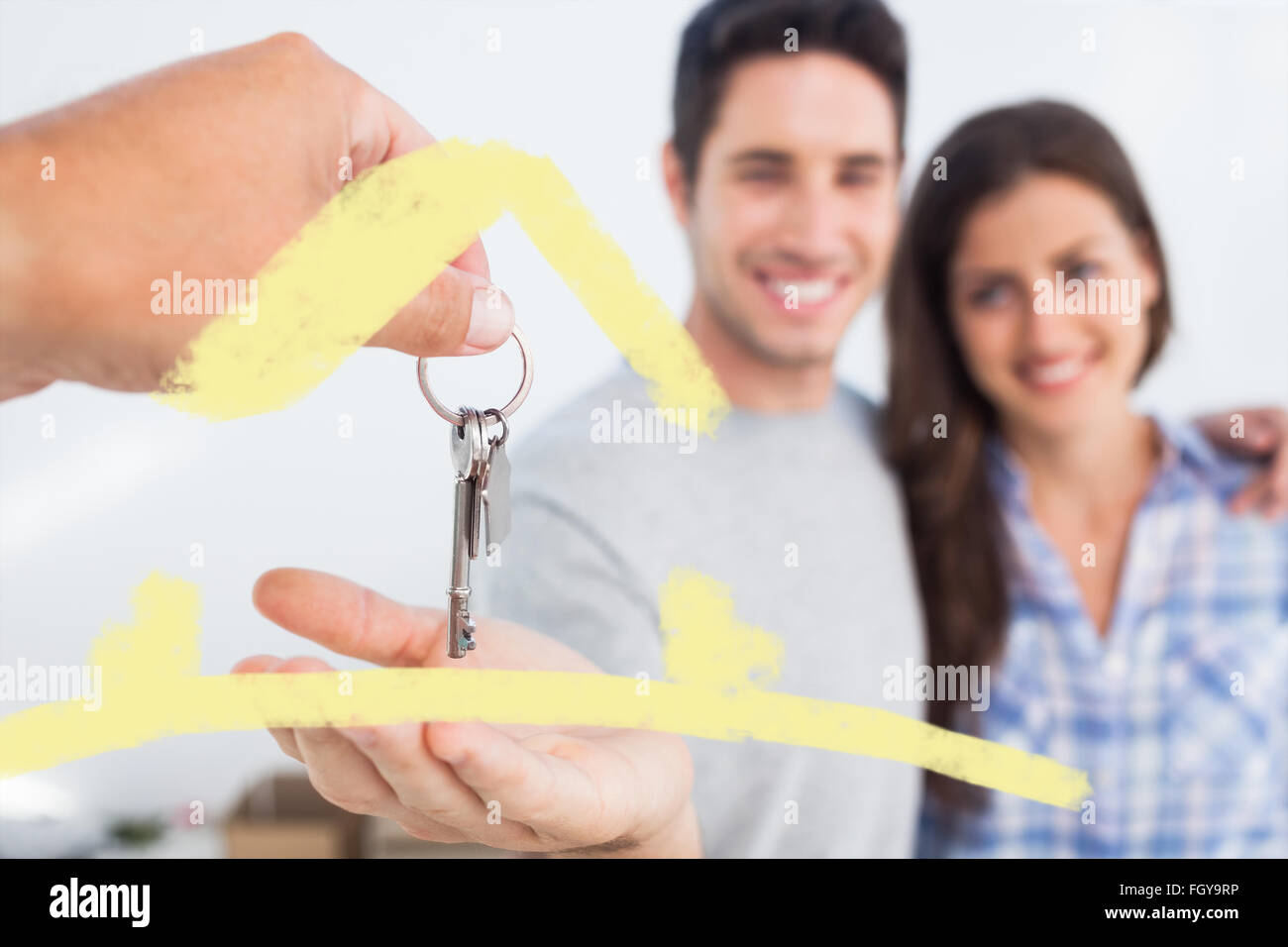 Composite image of man being given a house key Stock Photo - Alamy