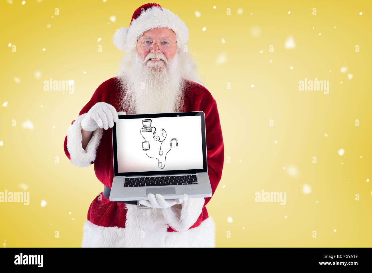 Santa claus presents a laptop Stock Photo - Alamy