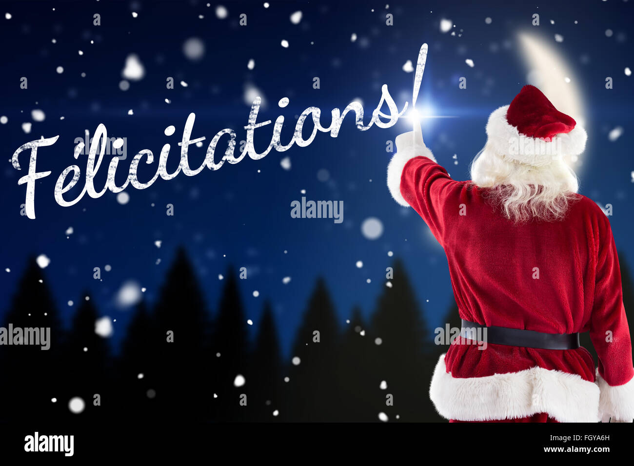 Composite image of santa claus points at something Stock Photo - Alamy