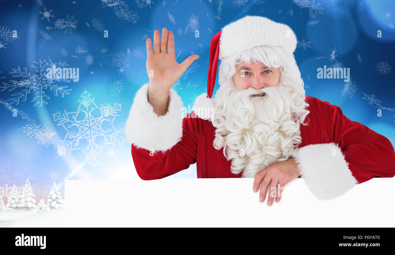 Composite image of portrait of santa claus waving Stock Photo - Alamy