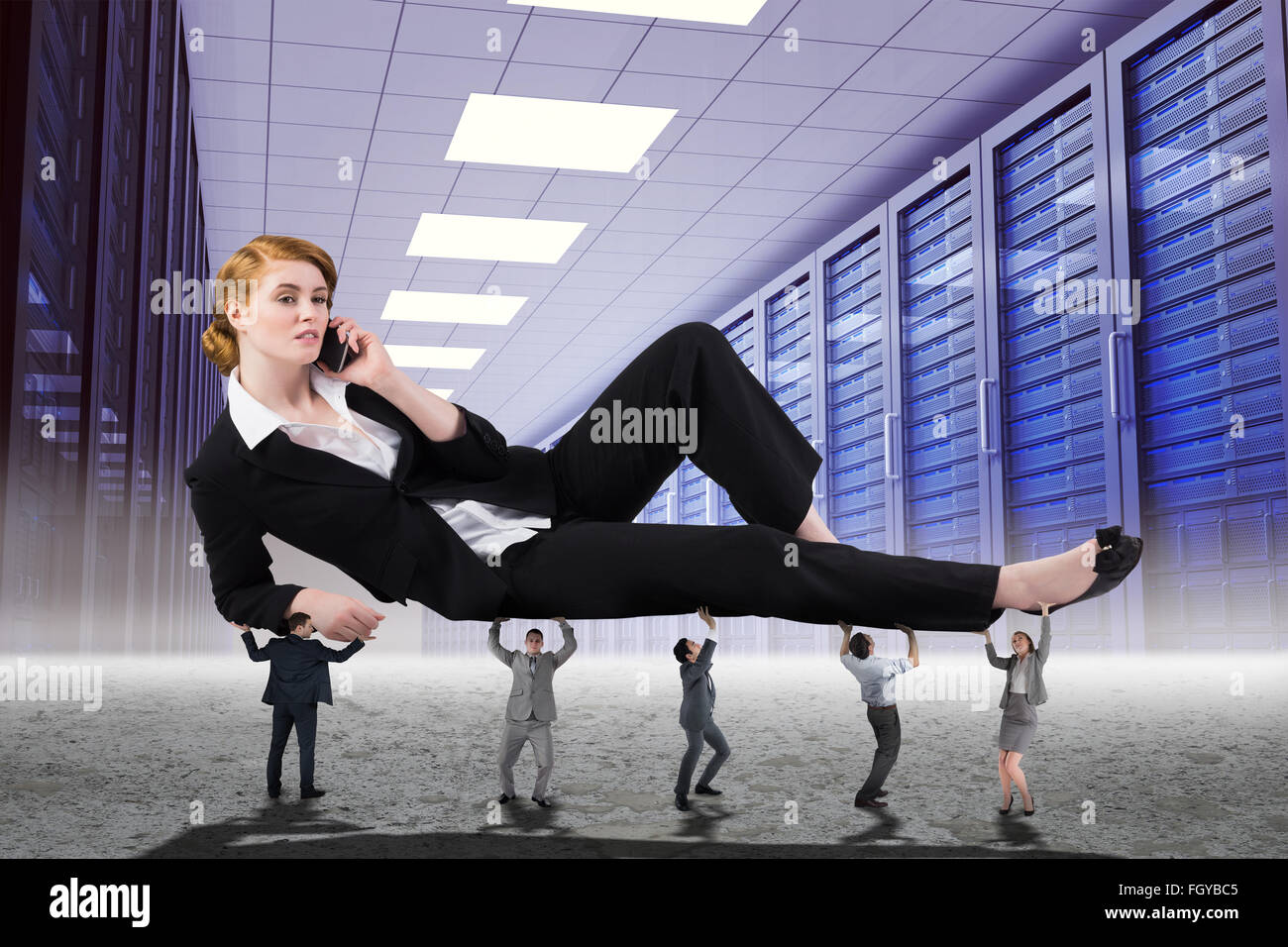 Composite image of business people supporting boss Stock Photo - Alamy