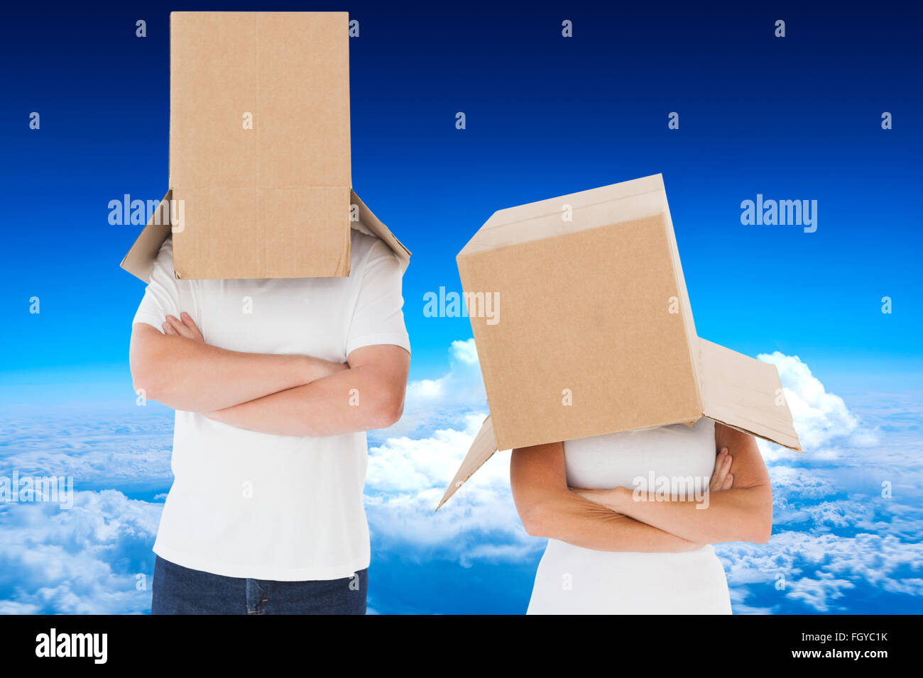 Composite image of mature couple wearing boxes over their heads Stock ...