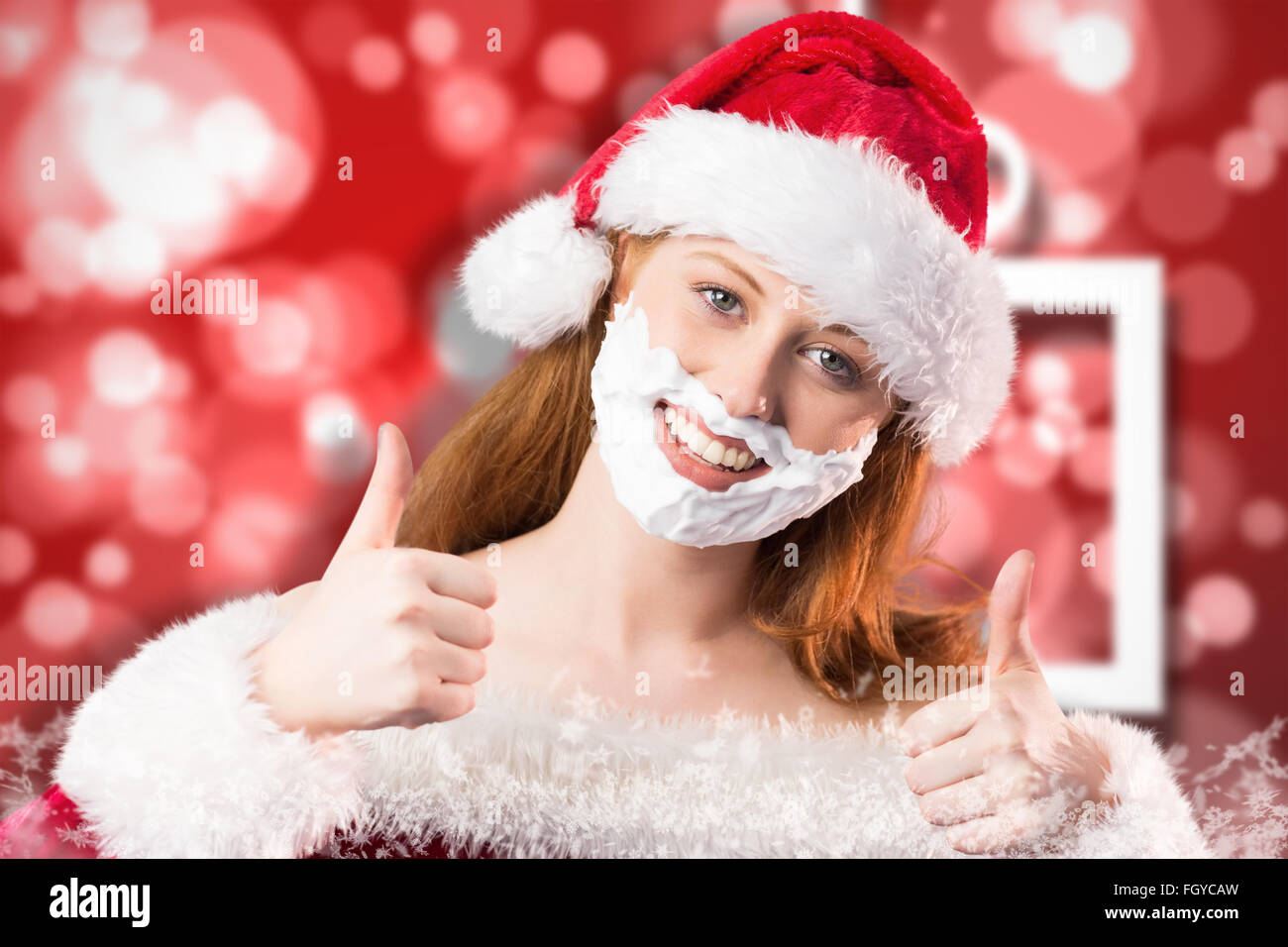 Composite image of festive redhead in foam beard Stock Photo - Alamy