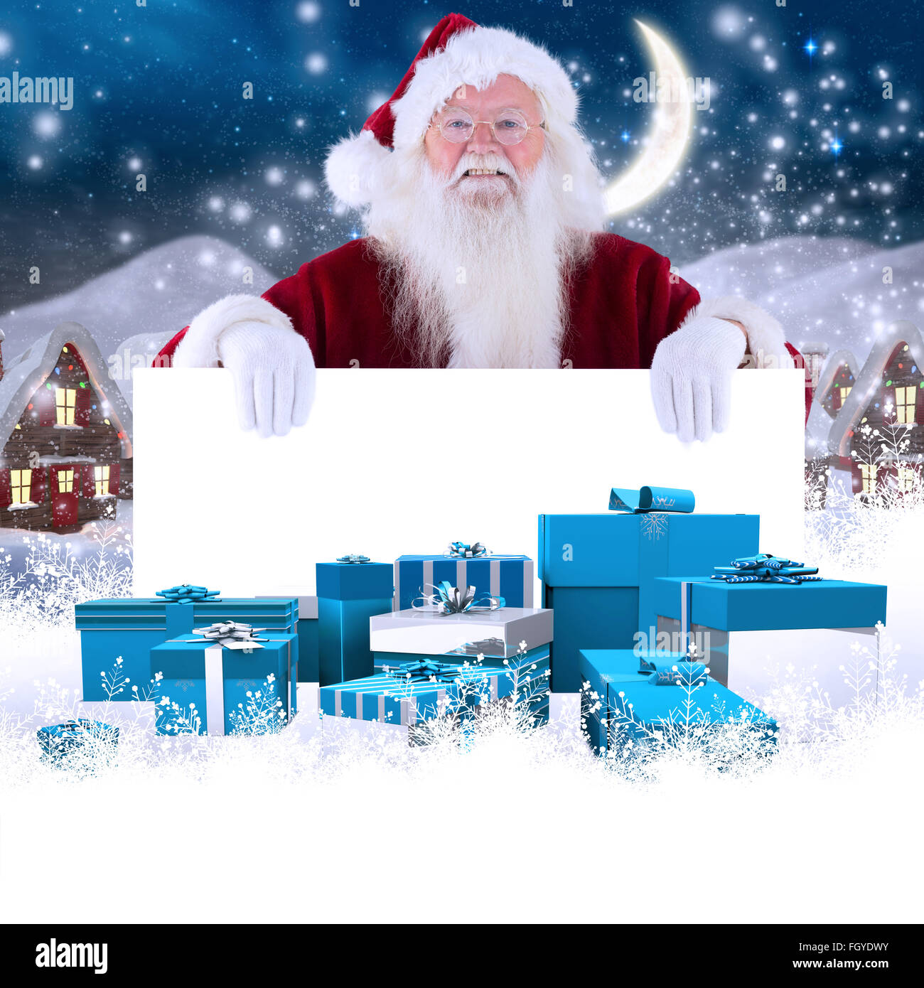 Composite image of santa looks over a sign Stock Photo - Alamy