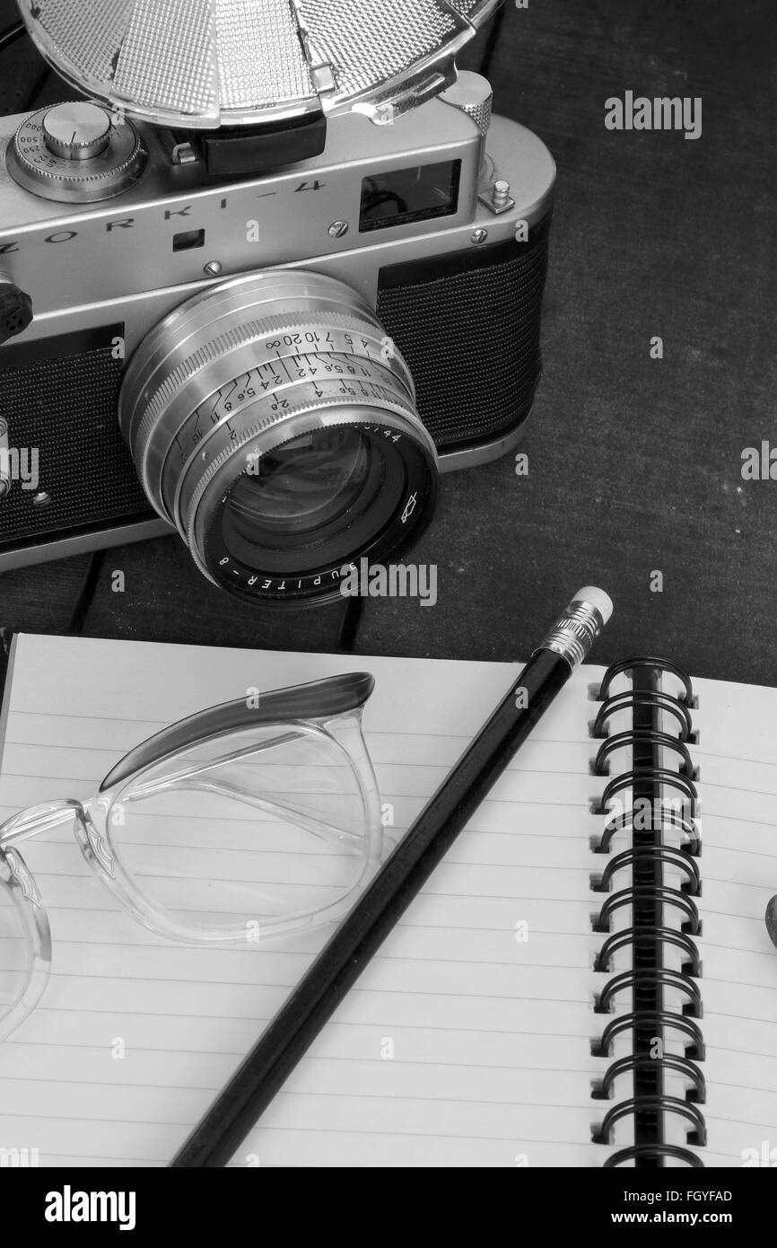 Concepts of a lady explorer , note book, old film camera, note book and ...