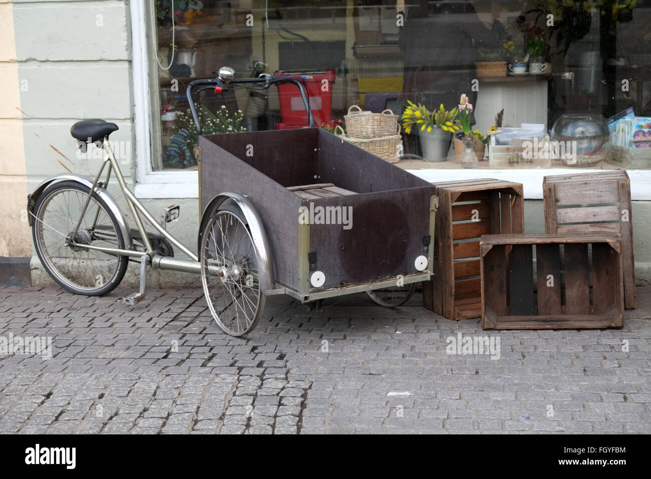 Environmentally friendly cargo bike with empty boxes or crates out side ...