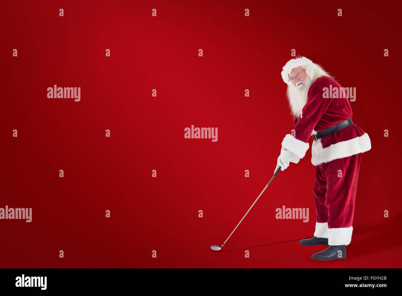Composite image of santa claus is playing golf Stock Photo - Alamy