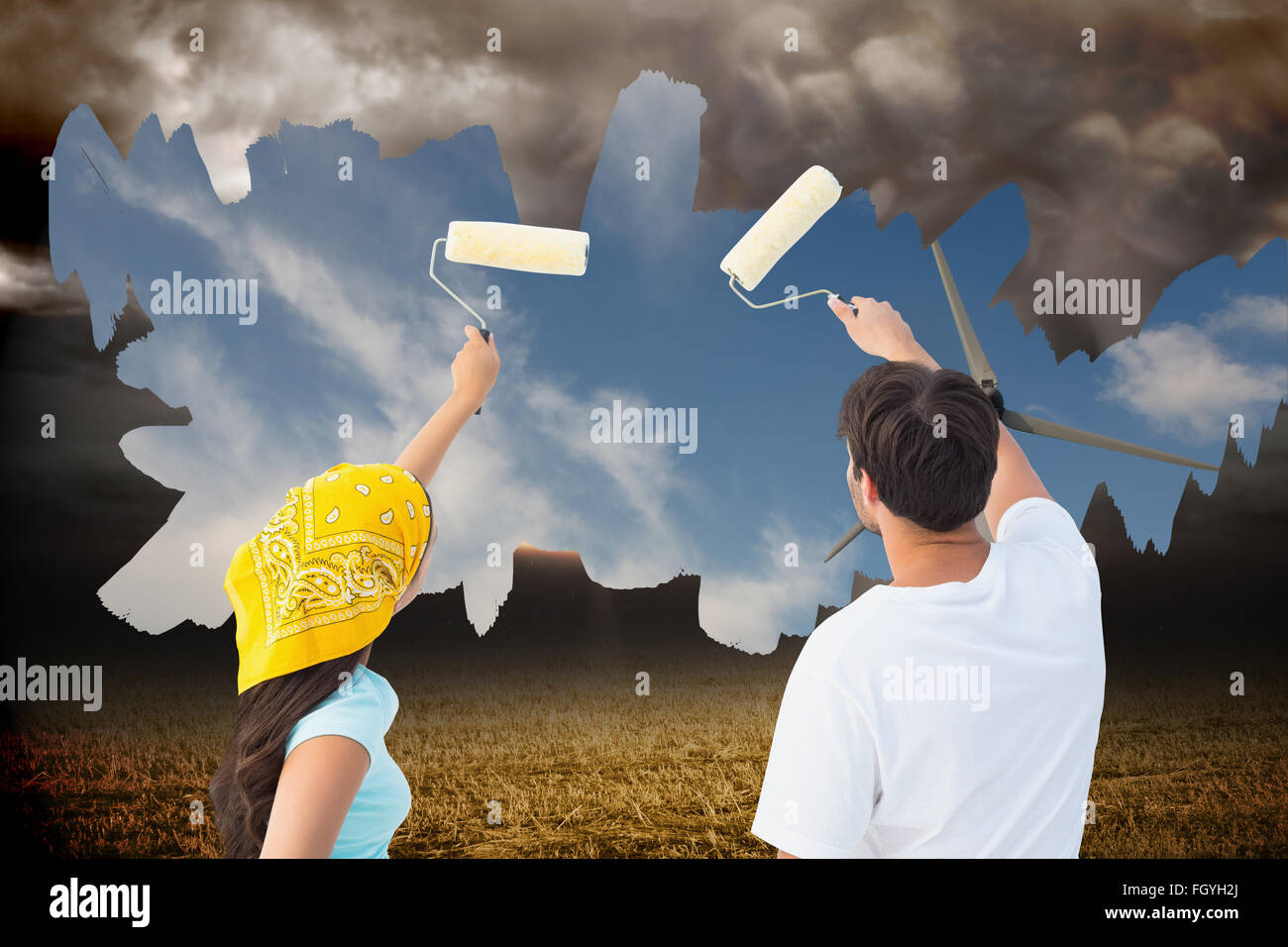 Composite image of happy young couple painting together Stock Photo - Alamy