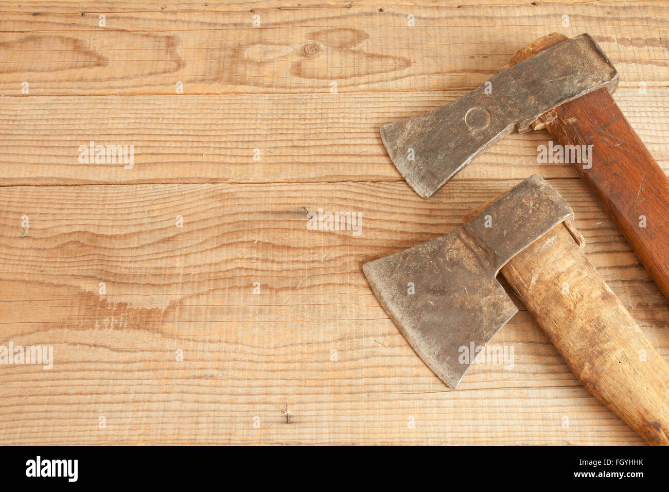 Two dated and used cleavers on wooden background Stock Photo - Alamy