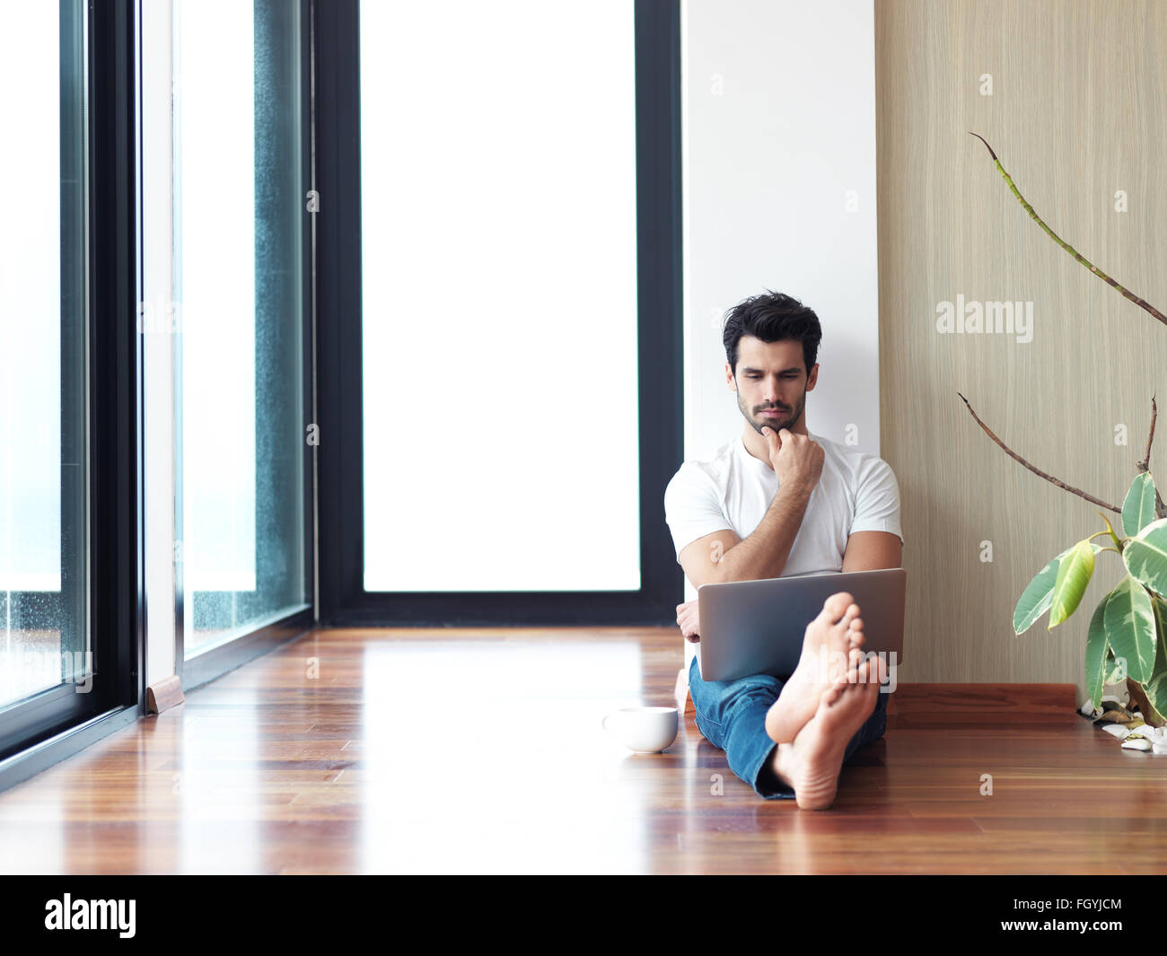 working on laptop computer from home Stock Photo - Alamy
