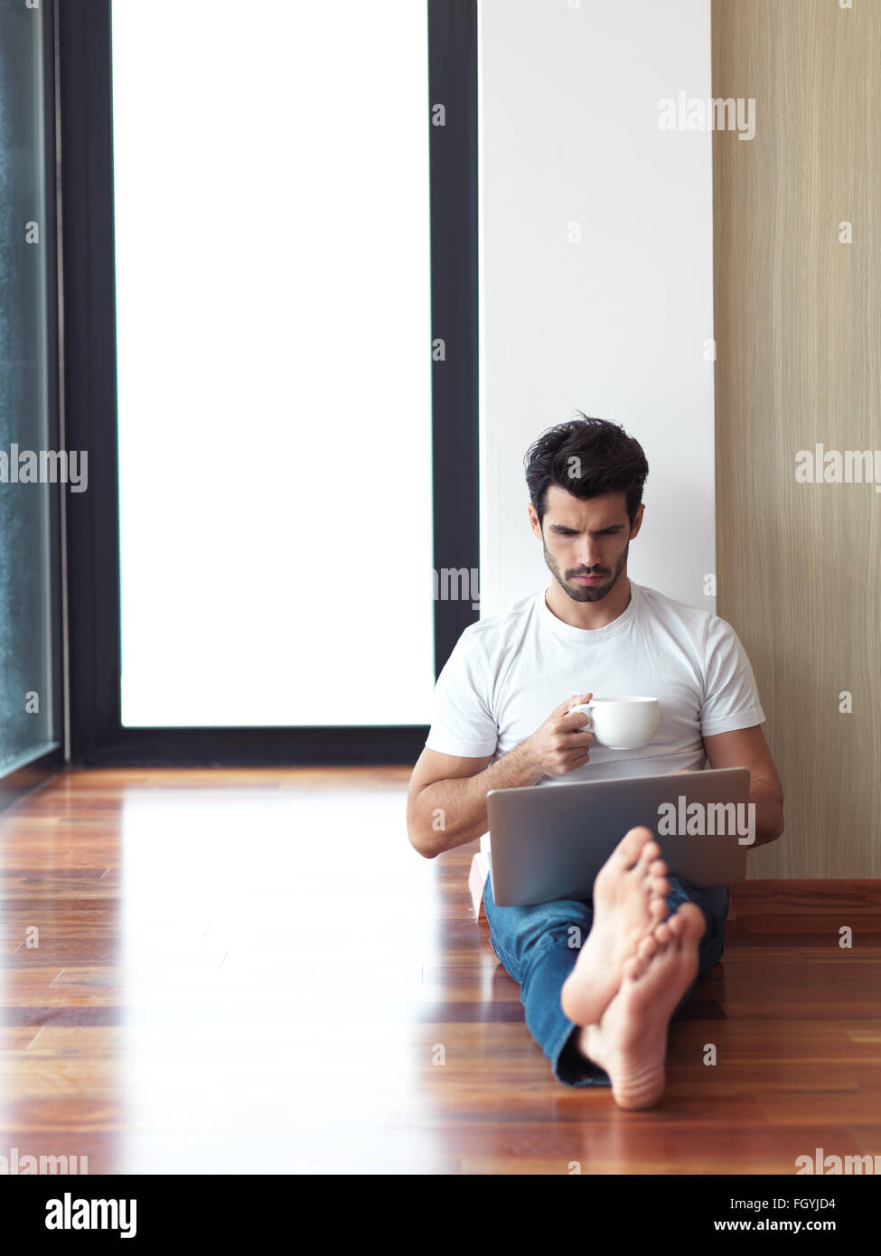 working on laptop computer from home Stock Photo - Alamy