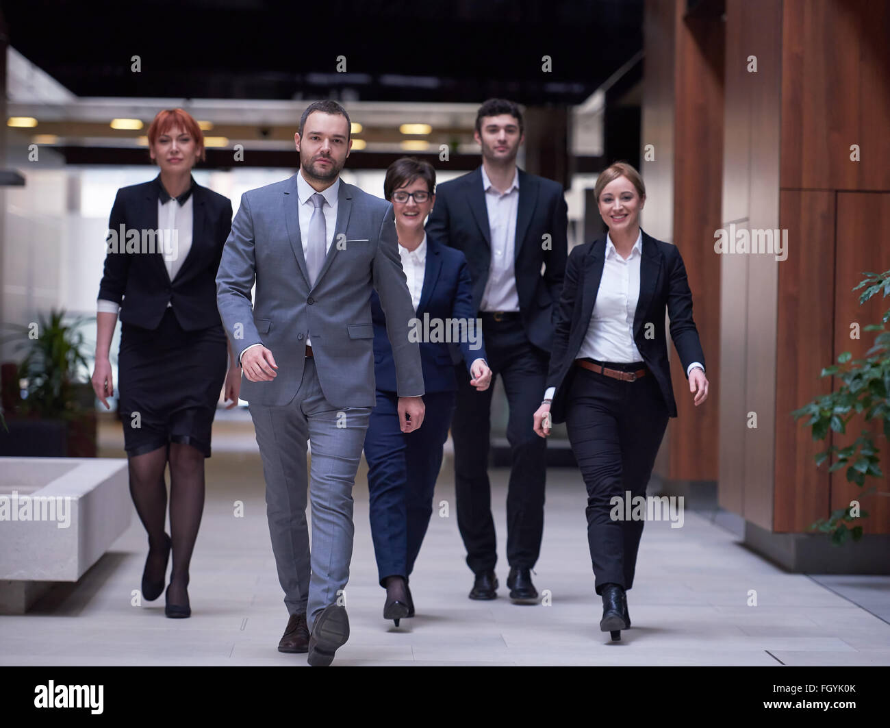 business people team walking Stock Photo - Alamy