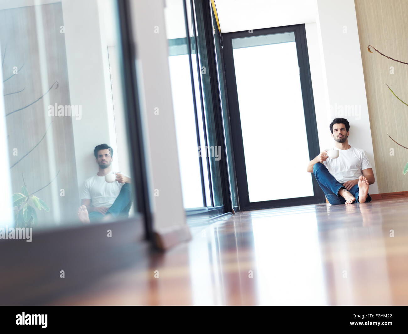 relaxed young man drink first morning coffee Stock Photo - Alamy