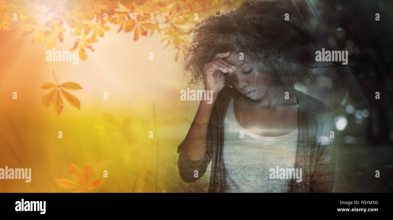 Composite image of sad woman holding her forehead with her hand Stock ...