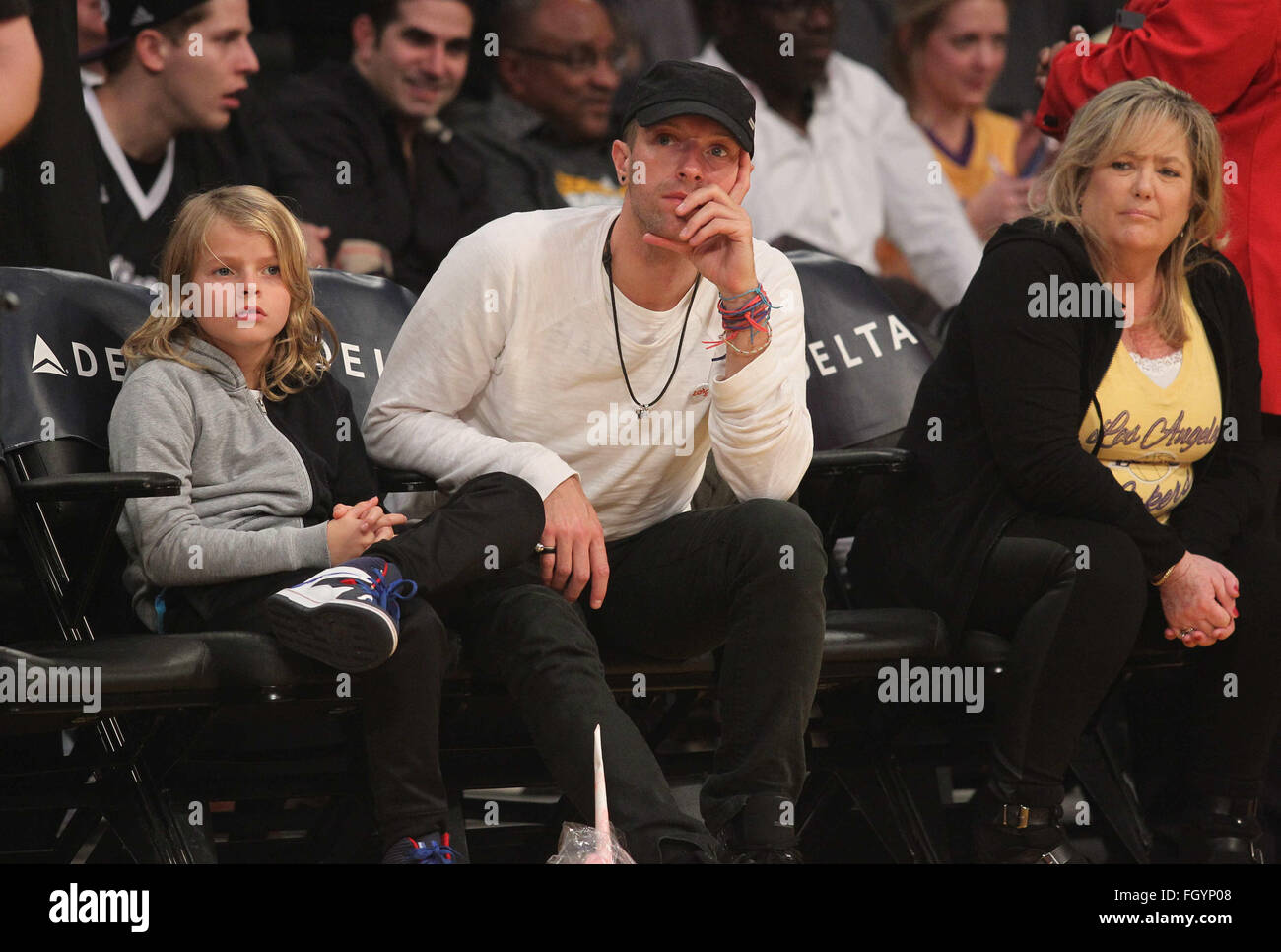 Chris Martin and his son Moses Martin watch the Sacramento Kings defeat ...