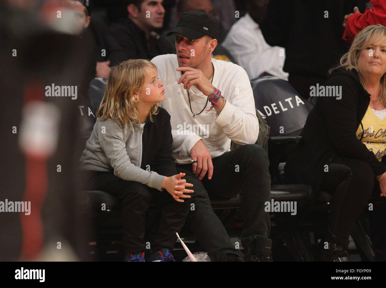 Chris Martin and his son Moses Martin watch the Sacramento Kings defeat ...