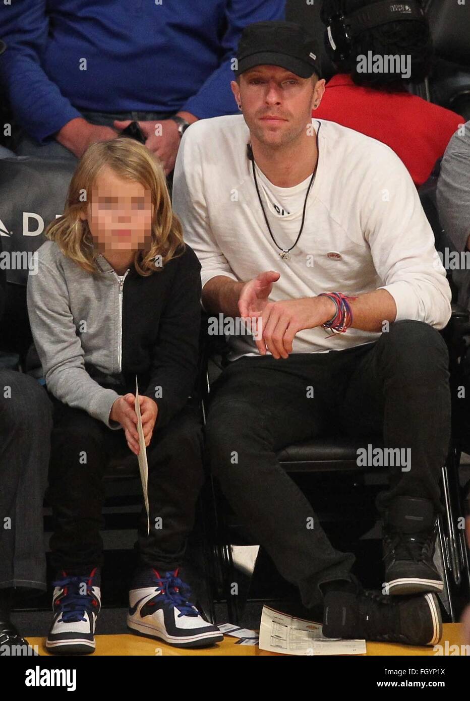 Chris Martin and his son Moses Martin watch the Sacramento Kings defeat ...