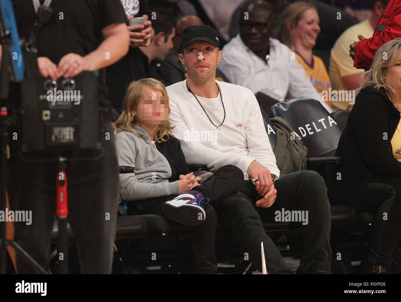 Chris Martin and his son Moses Martin watch the Sacramento Kings defeat ...