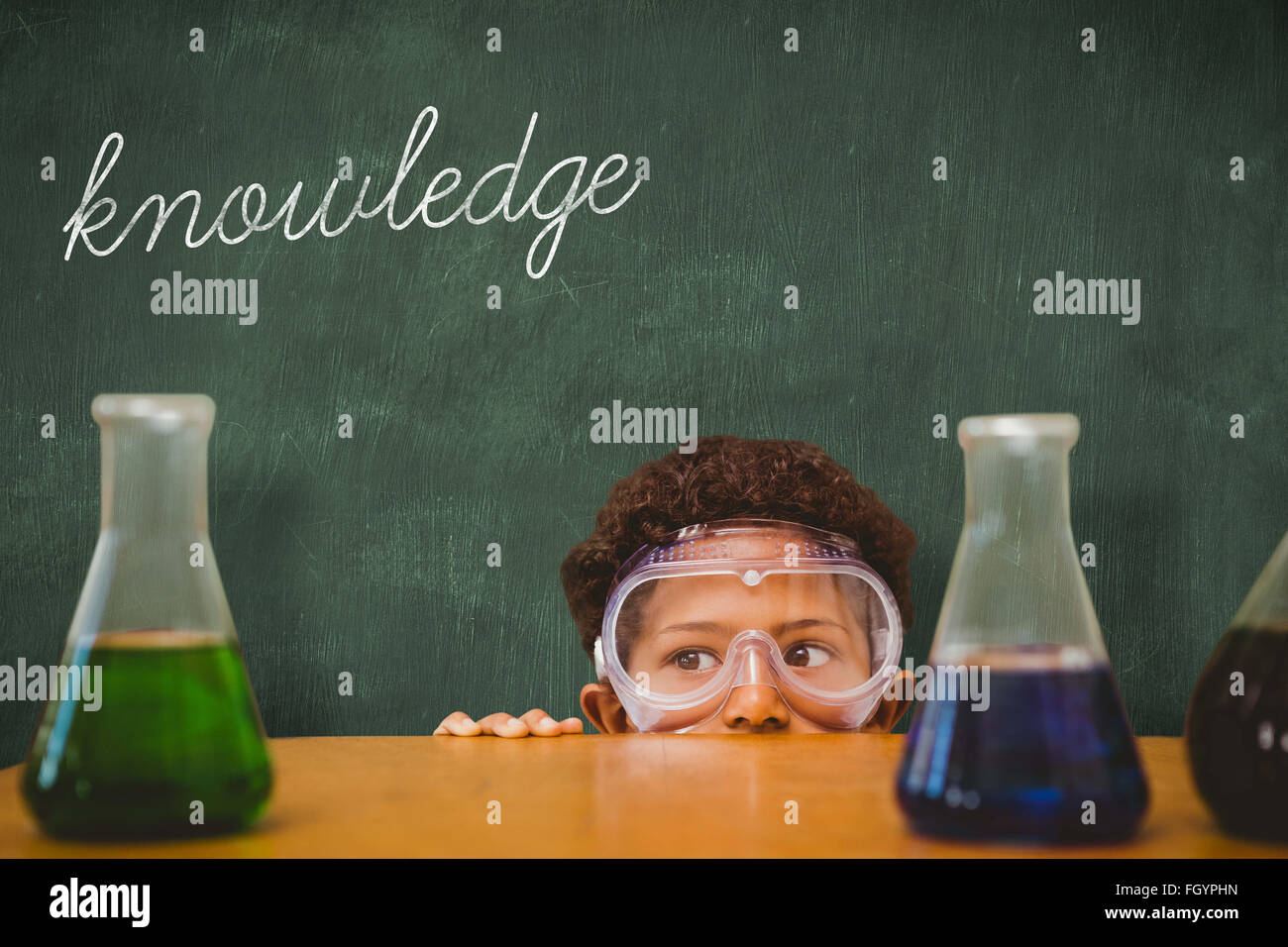 Knowledge against green chalkboard Stock Photo - Alamy