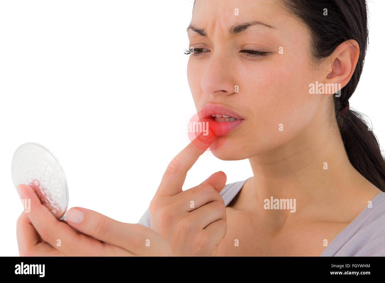 Composite image of worried woman looking at her lips Stock Photo - Alamy