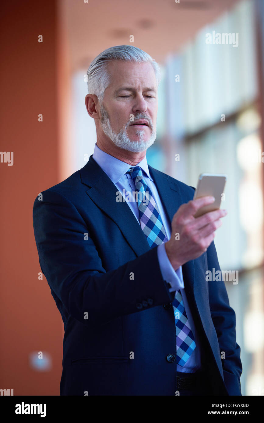 senior business man talk on mobile phone Stock Photo - Alamy