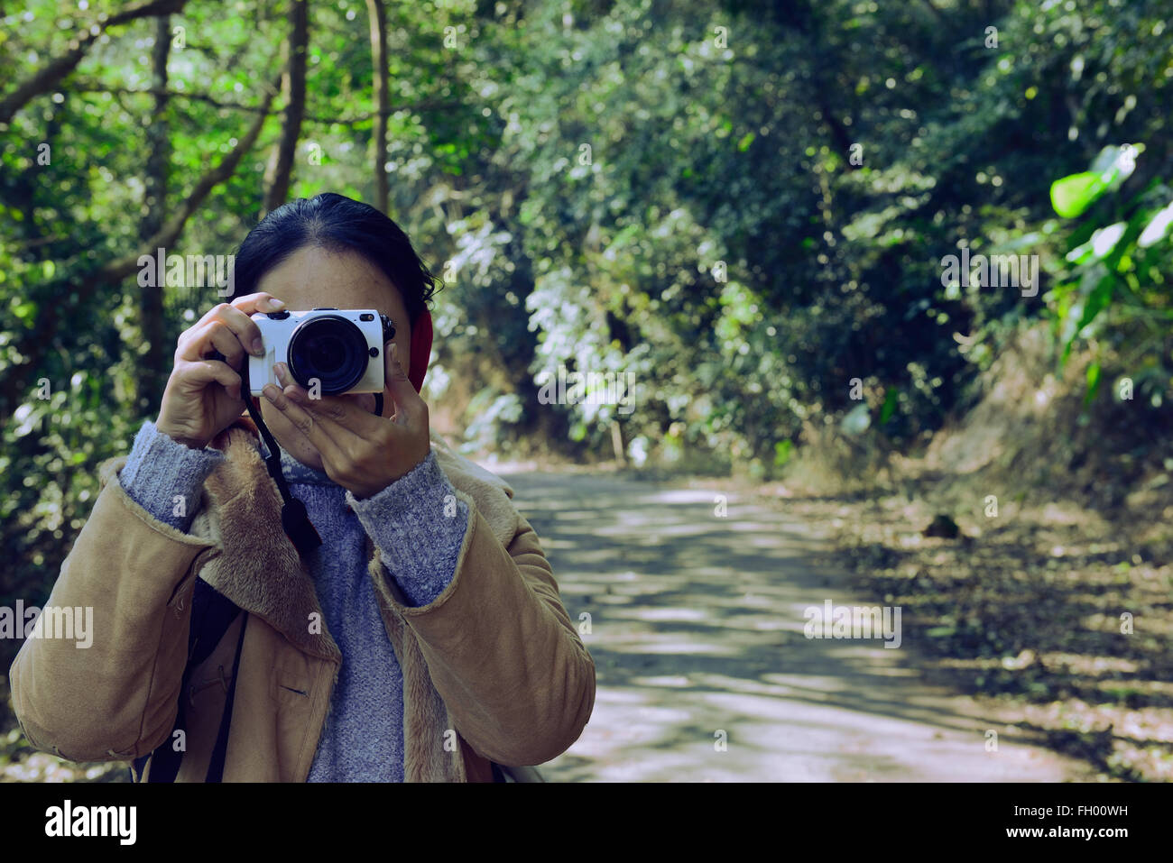 A mini camera is very convenient when you go sightseeing Stock Photo ...