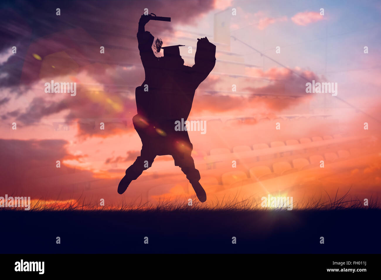 Happy jumping graduate holding diploma hi-res stock photography and ...