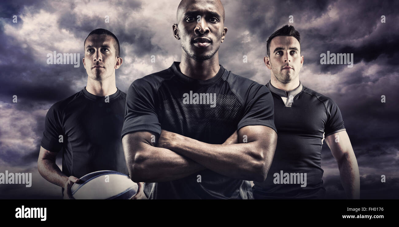 Composite image of portrait of confident rugby player with arms crossed ...
