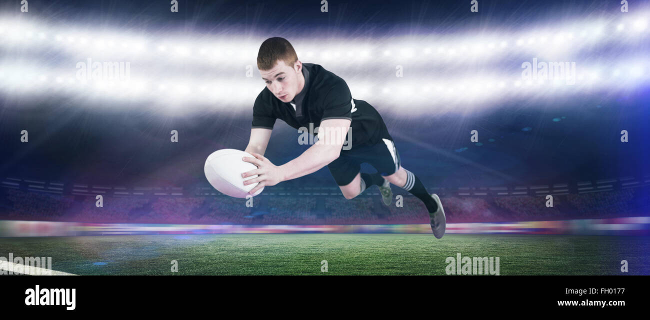 Composite image of a rugby player scoring a try Stock Photo - Alamy
