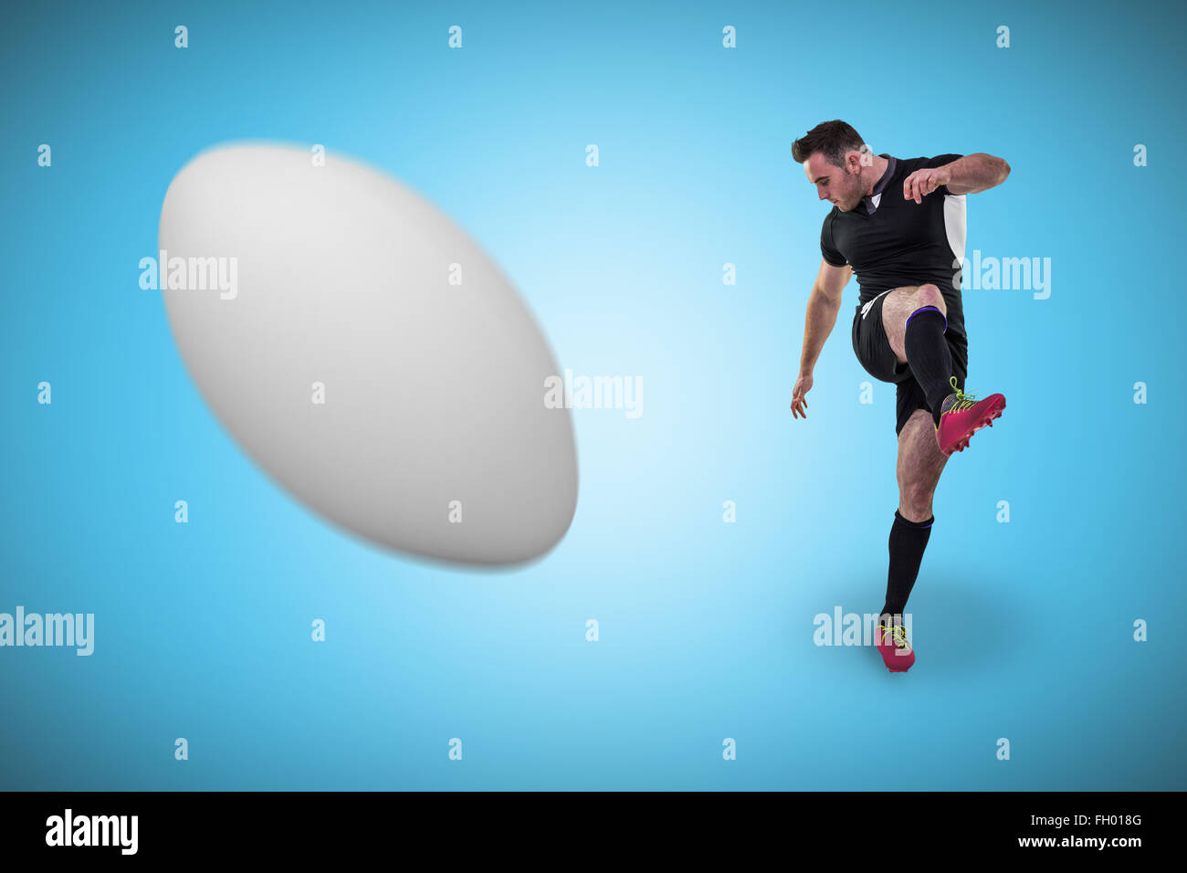Composite image of rugby player kicking Stock Photo - Alamy