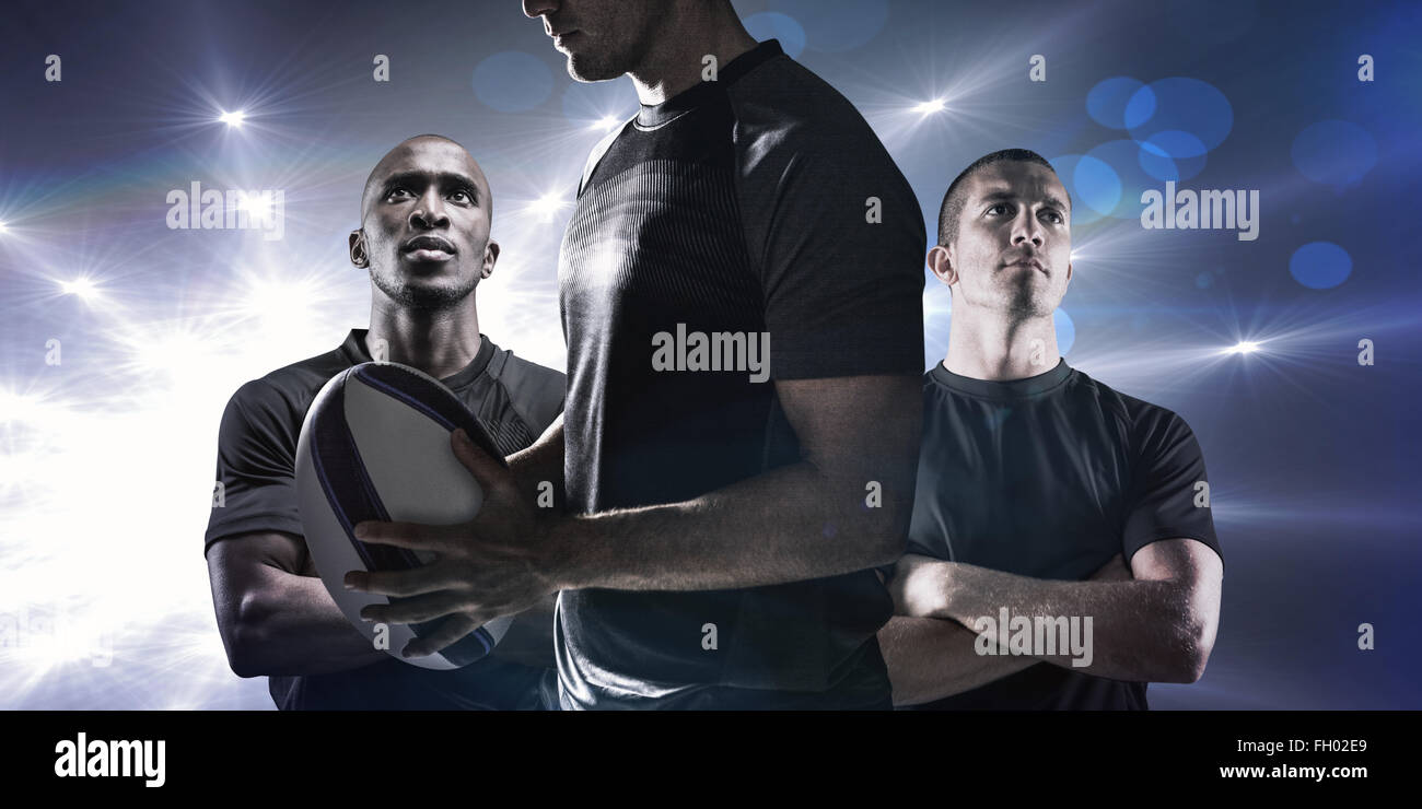 Composite image of calm rugby player thinking while holding ball Stock ...