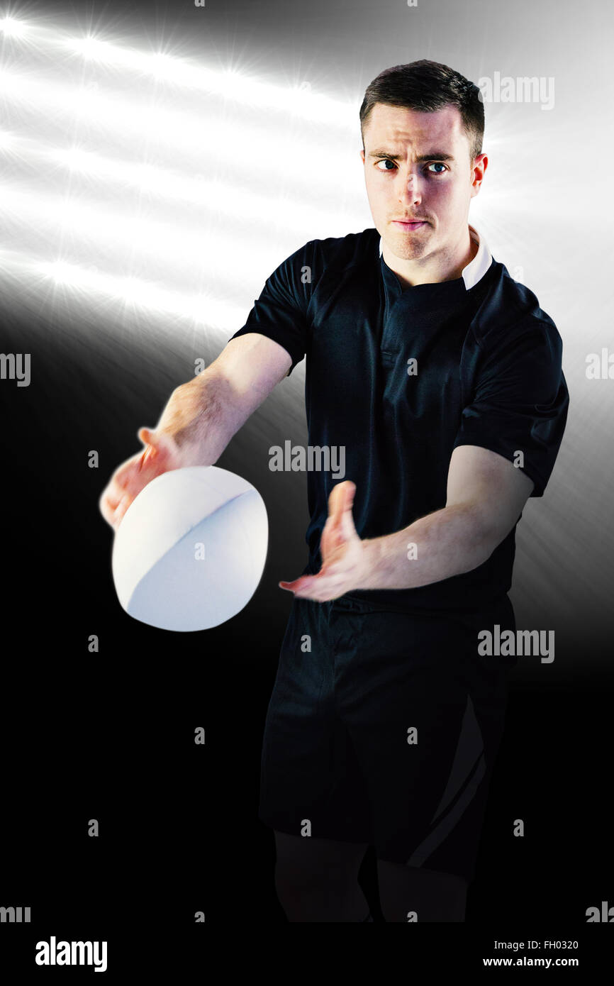 Composite image of rugby player about to throw a rugby ball Stock Photo ...