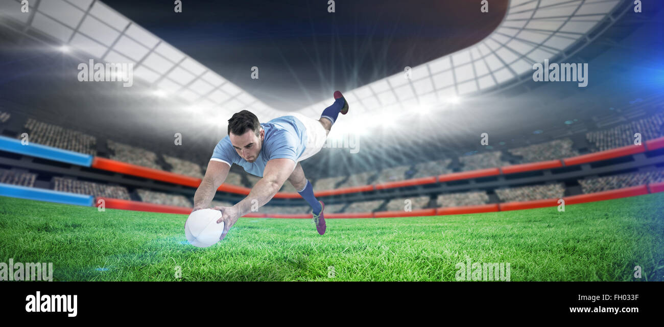 Composite image of rugby player scoring a try Stock Photo - Alamy