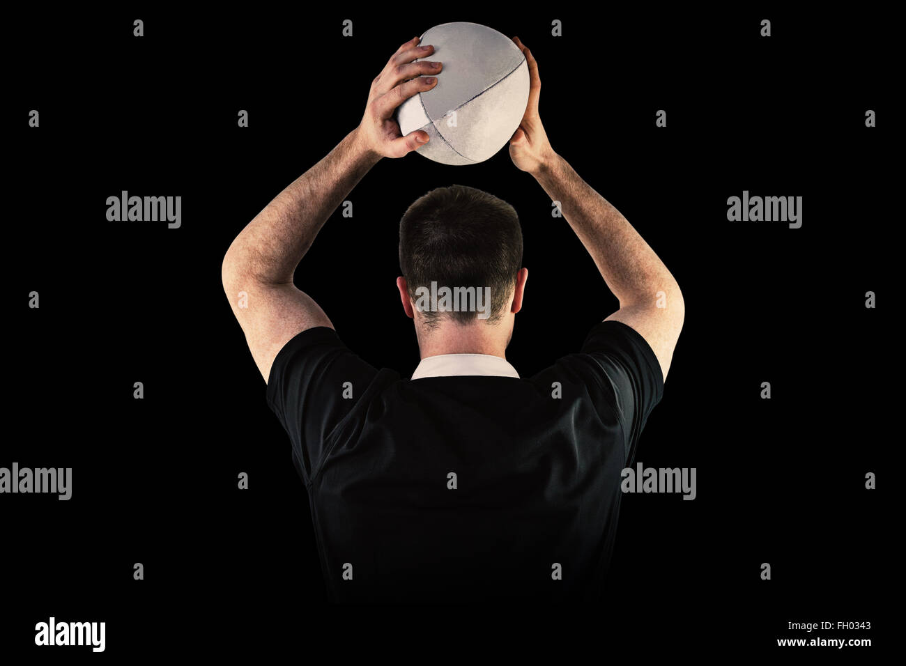 Composite image of rugby player about to throw a rugby ball Stock Photo ...
