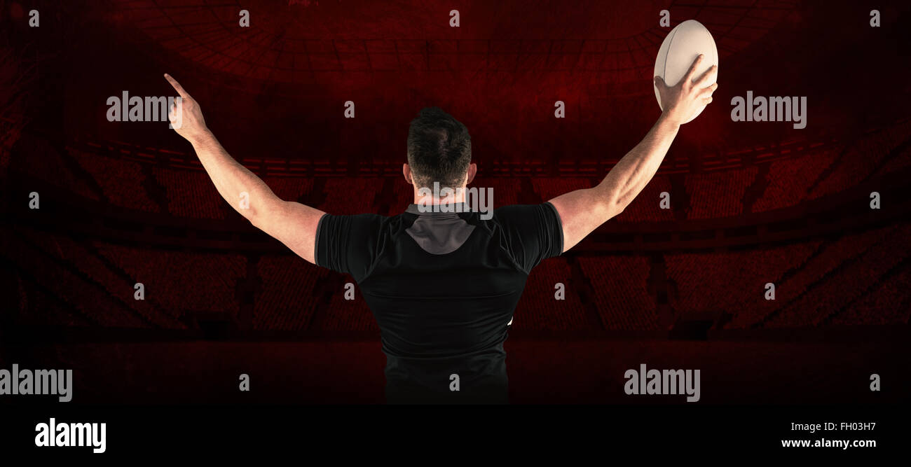 Composite image of rugby player celebrating with the ball Stock Photo ...
